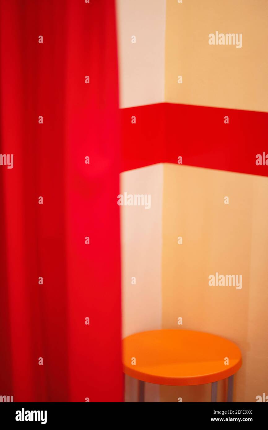 Stool in a corner Stock Photo - Alamy