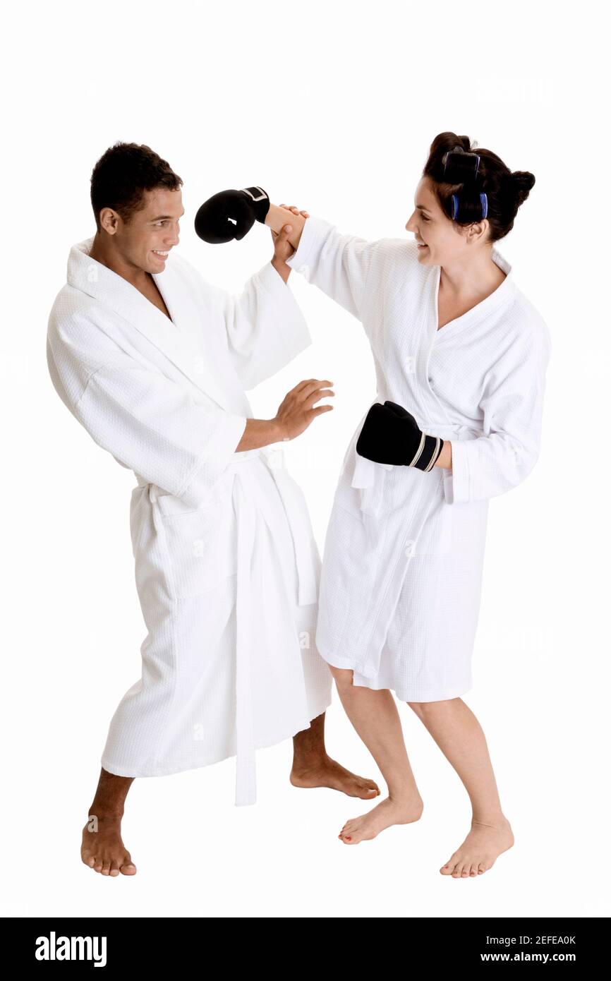 Side profile of a young couple sparring Stock Photo - Alamy