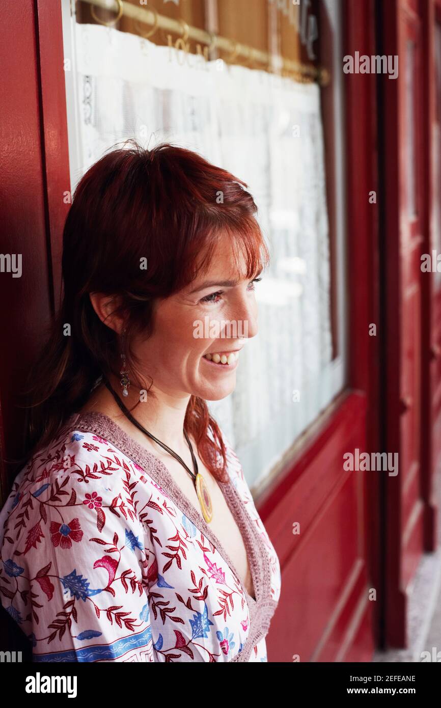 Side profile of a young woman smiling Stock Photo - Alamy
