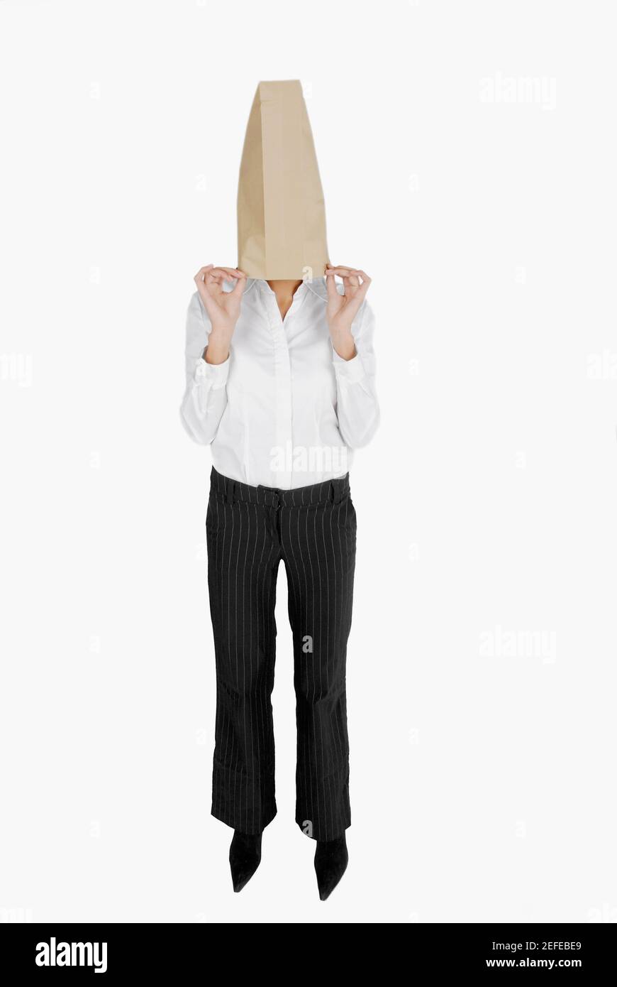 Businesswoman covering her face with a paper bag Stock Photo - Alamy
