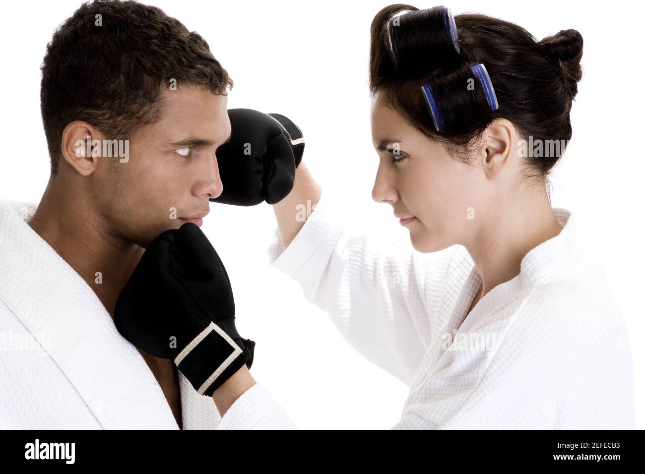 Side profile of a young couple sparring Stock Photo - Alamy