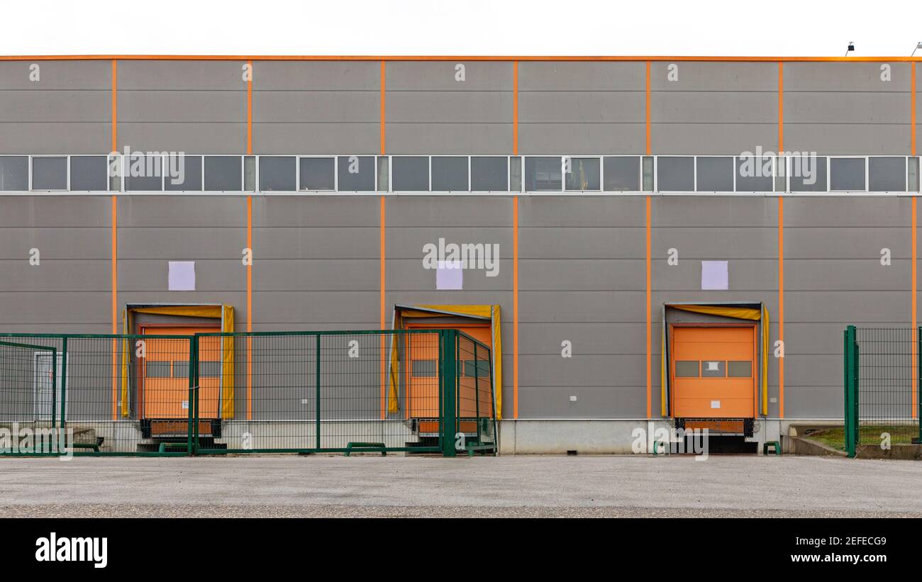 Loading Dock Cargo Doors at Distribution Warehouse Stock Photo - Alamy