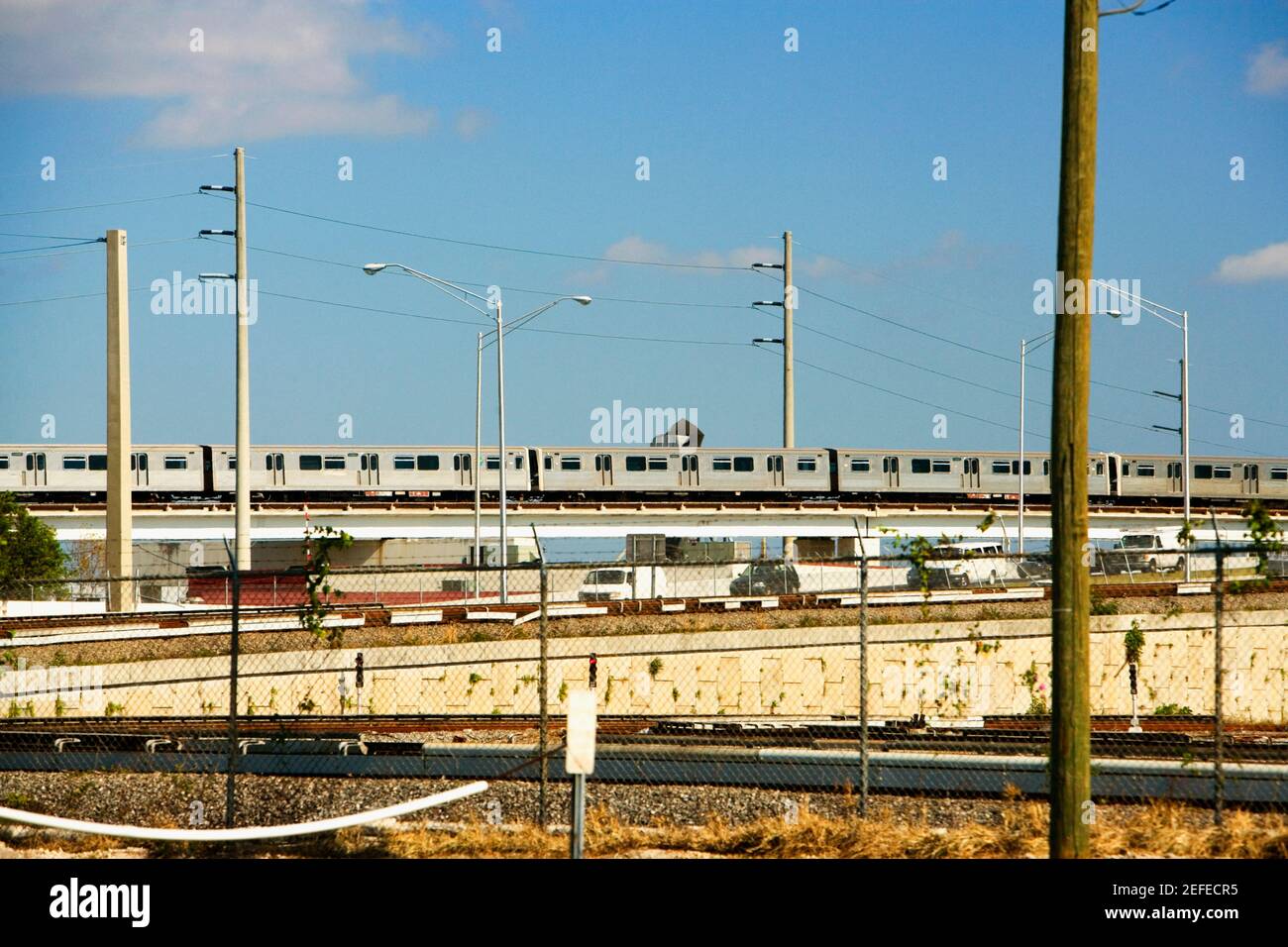 Low angle view of a passenger train on a railway bridge, Miami, Florida ...