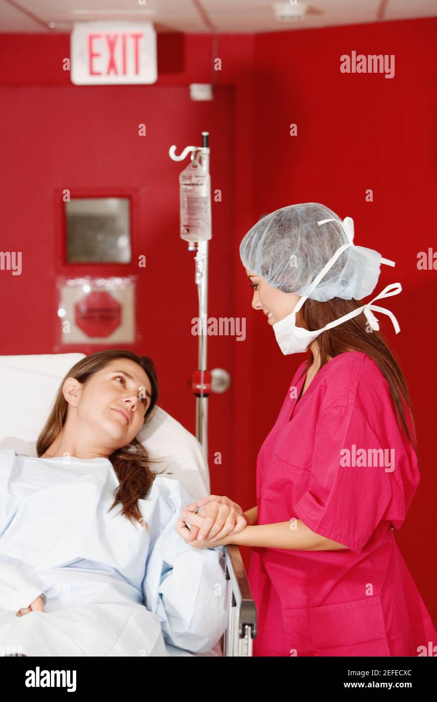 Female doctor consoling a female patient Stock Photo - Alamy