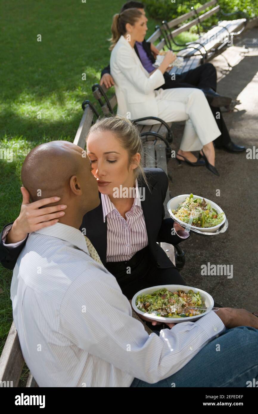 Couple kissing in office hi-res stock photography and images - Alamy