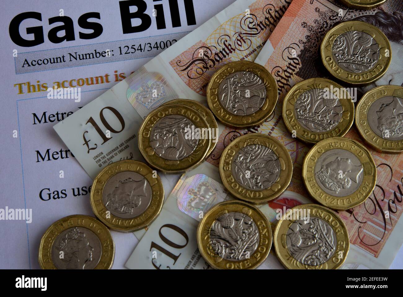 Gas bill and pound coins hi-res stock photography and images - Alamy