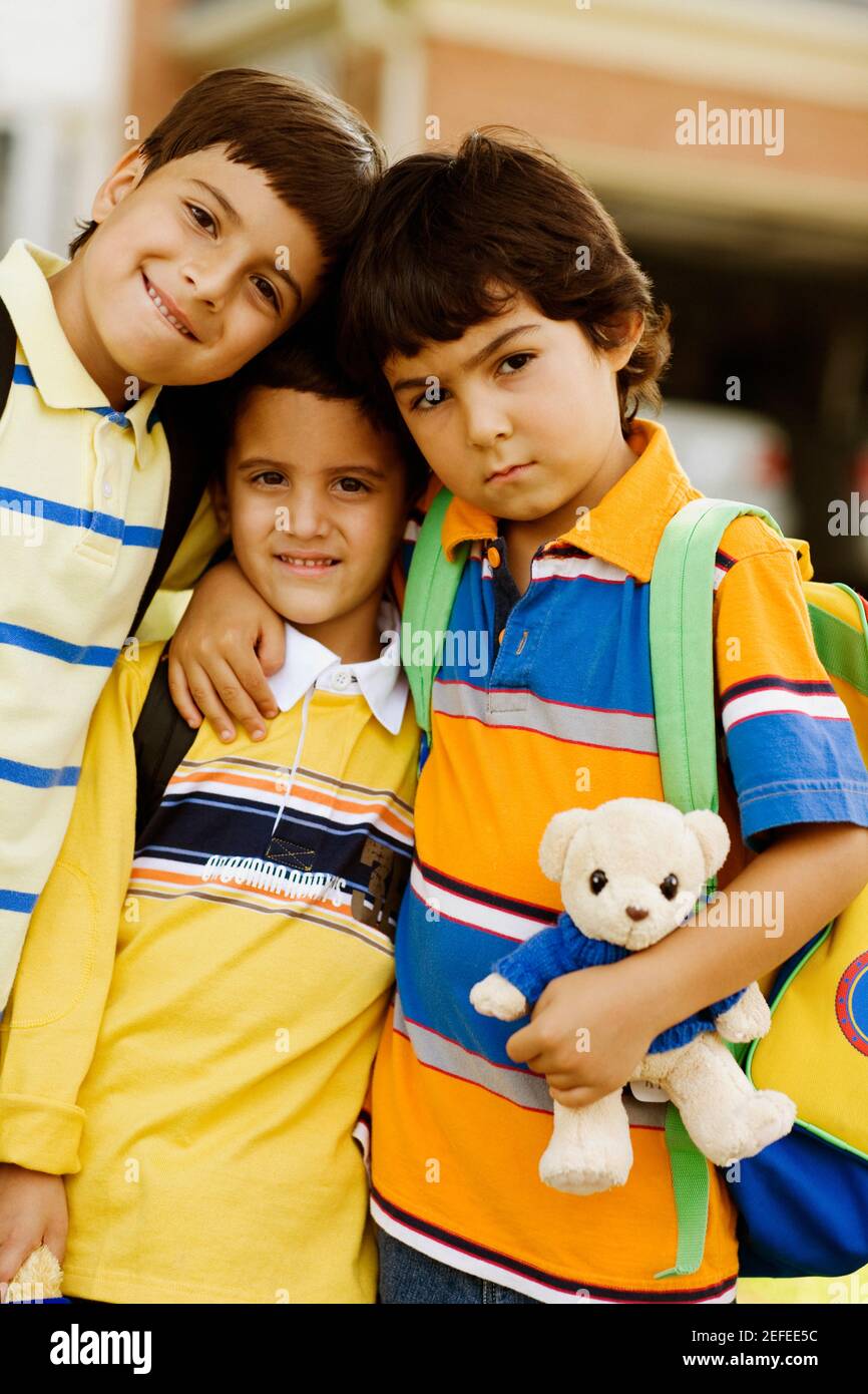 Portrait of three schoolboys standing together Stock Photo - Alamy