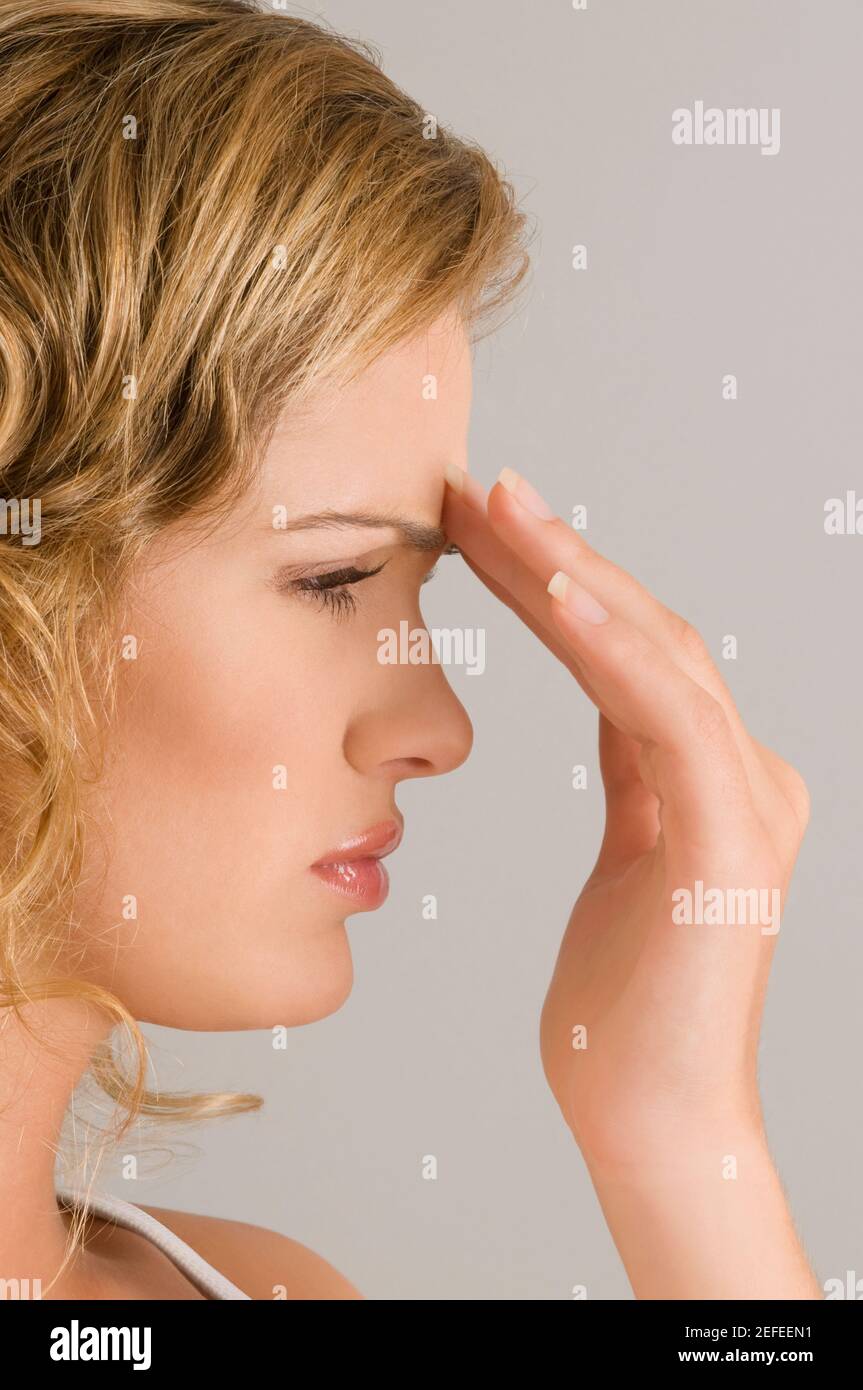 Finger forehead woman hi-res stock photography and images - Alamy