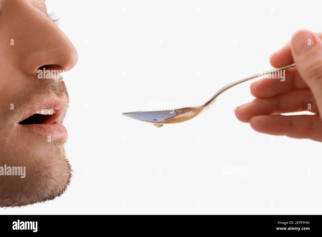 Man holding a spoon hi-res stock photography and images - Alamy