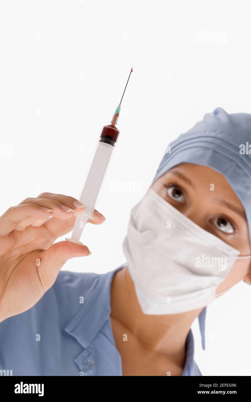 Close up of a female surgeon holding a syringe Stock Photo - Alamy