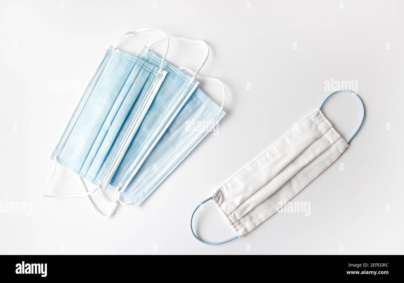 Reusable face mask and medical single use mask on on white background ...