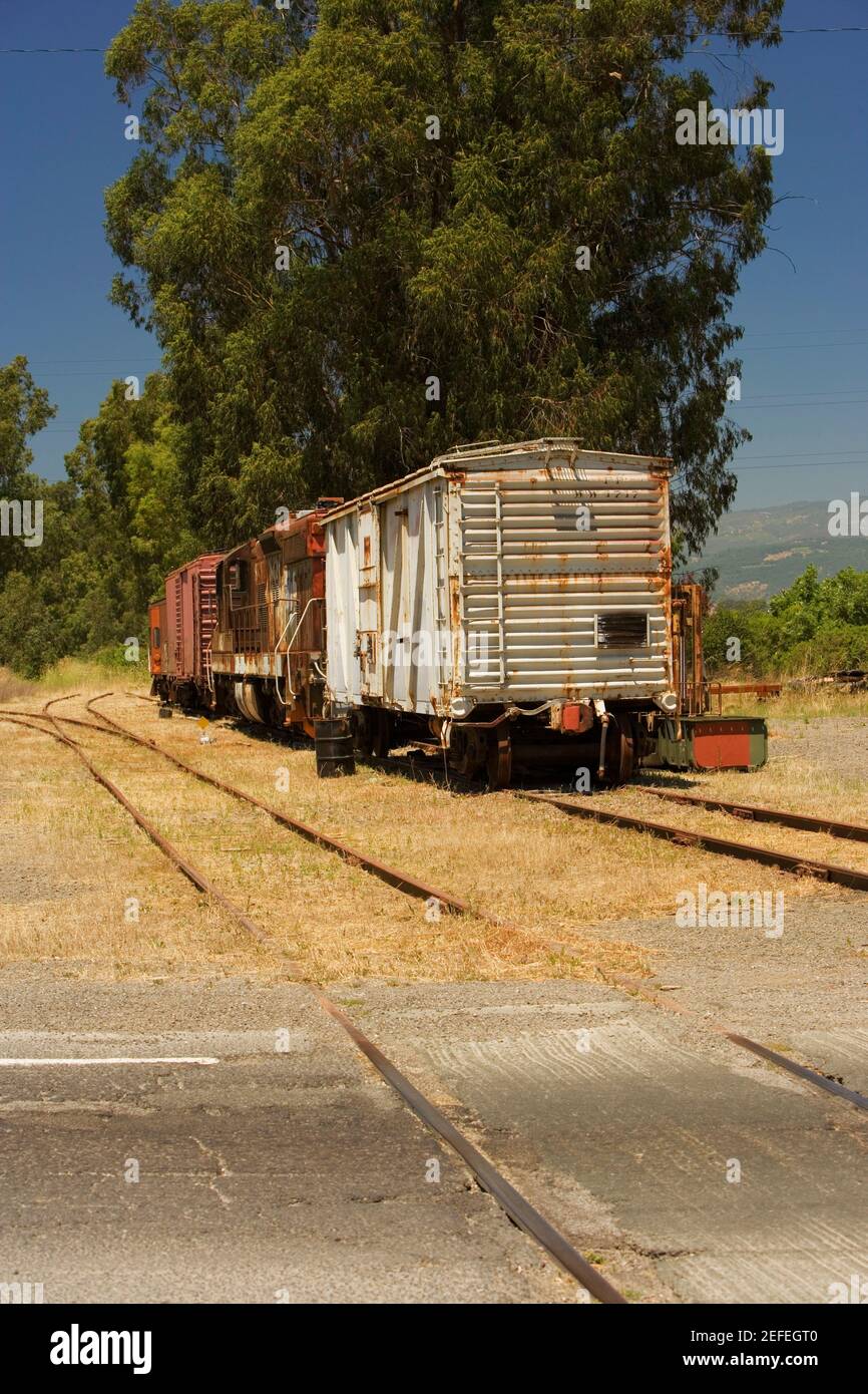 Abandoned freight train on railroad track Stock Photo - Alamy
