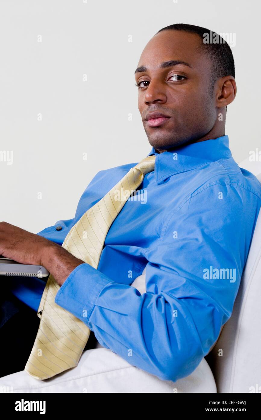Side profile of a businessman using a laptop Stock Photo - Alamy