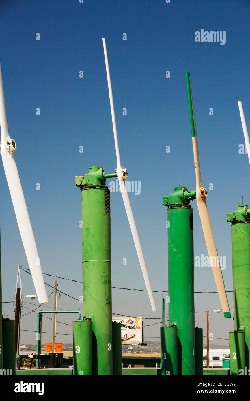 Side profile of an array of windmills on a farm Stock Photo - Alamy