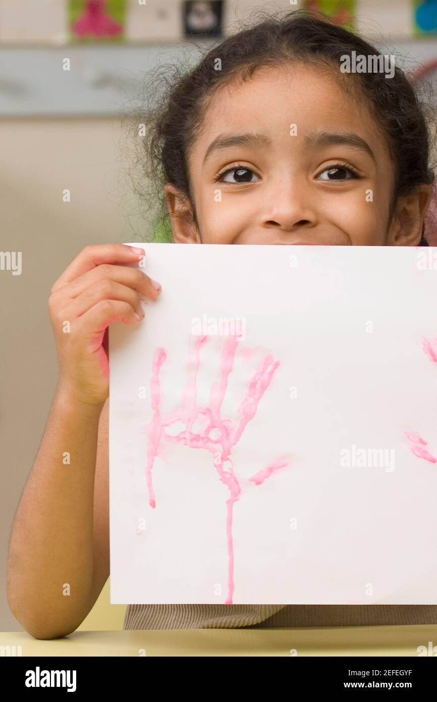 Close up of a girl showing a drawing Stock Photo - Alamy