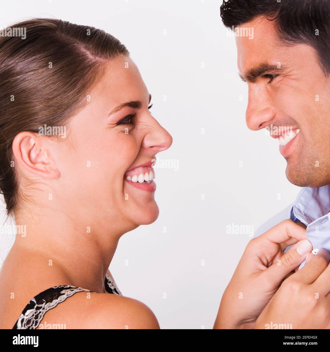 Woman buttoning shirt hi-res stock photography and images - Alamy