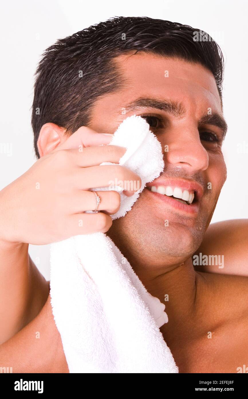 Woman wiping her face with a towel hi-res stock photography and images ...
