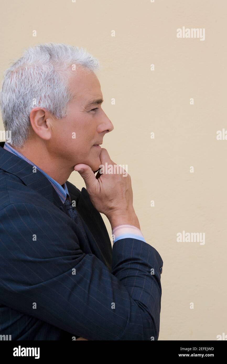 Side profile of a businessman thinking Stock Photo - Alamy