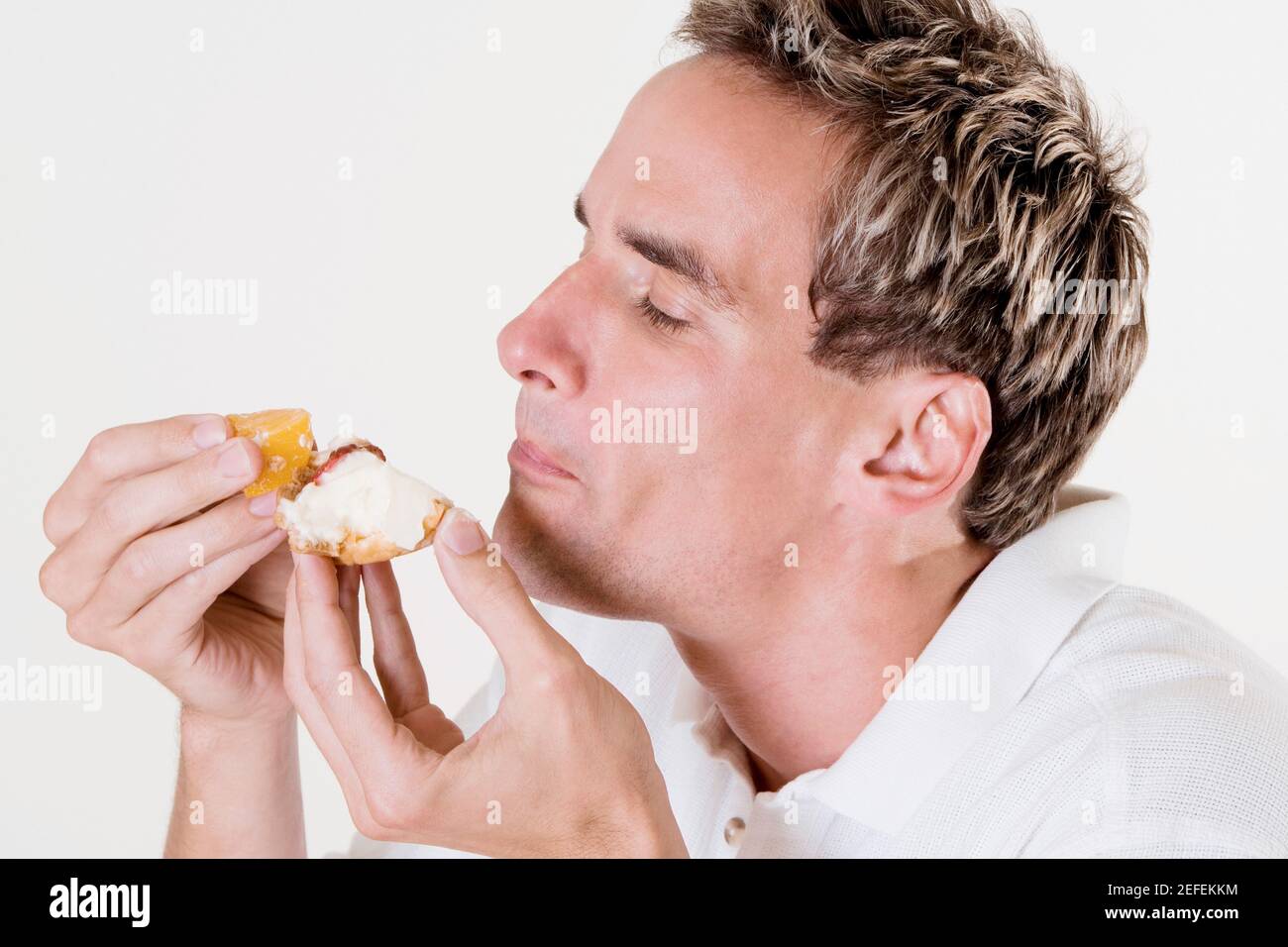 Male eating fruit with open mouth hi-res stock photography and images ...