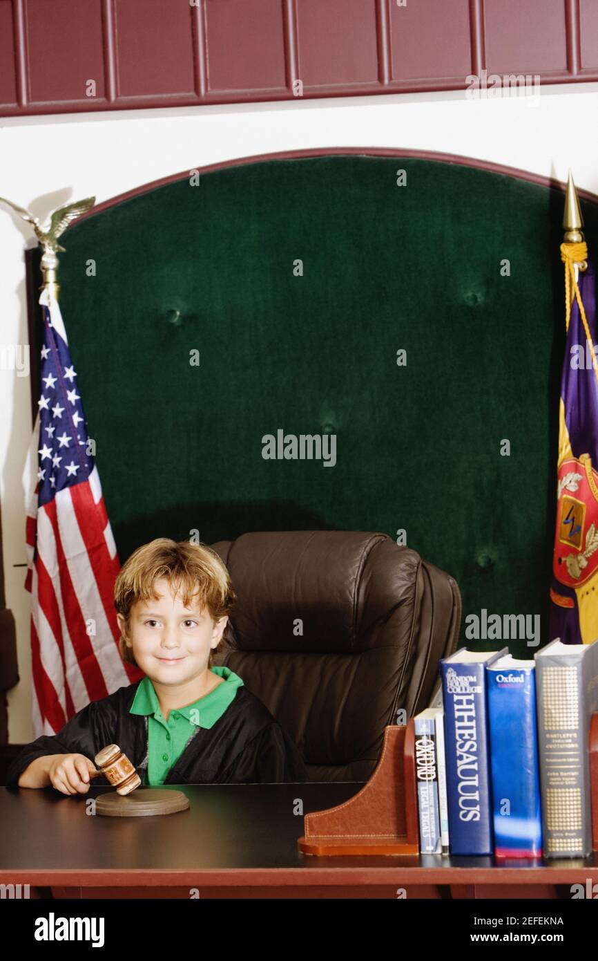 Boy imitating a judge in a courthouse Stock Photo - Alamy