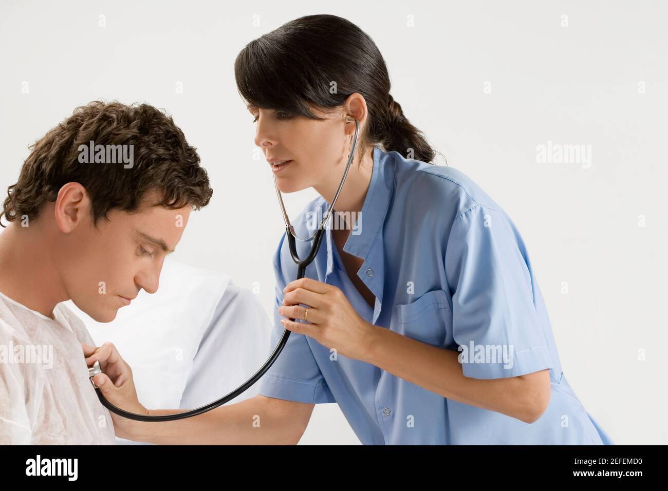 Female doctor examining a patient Stock Photo - Alamy