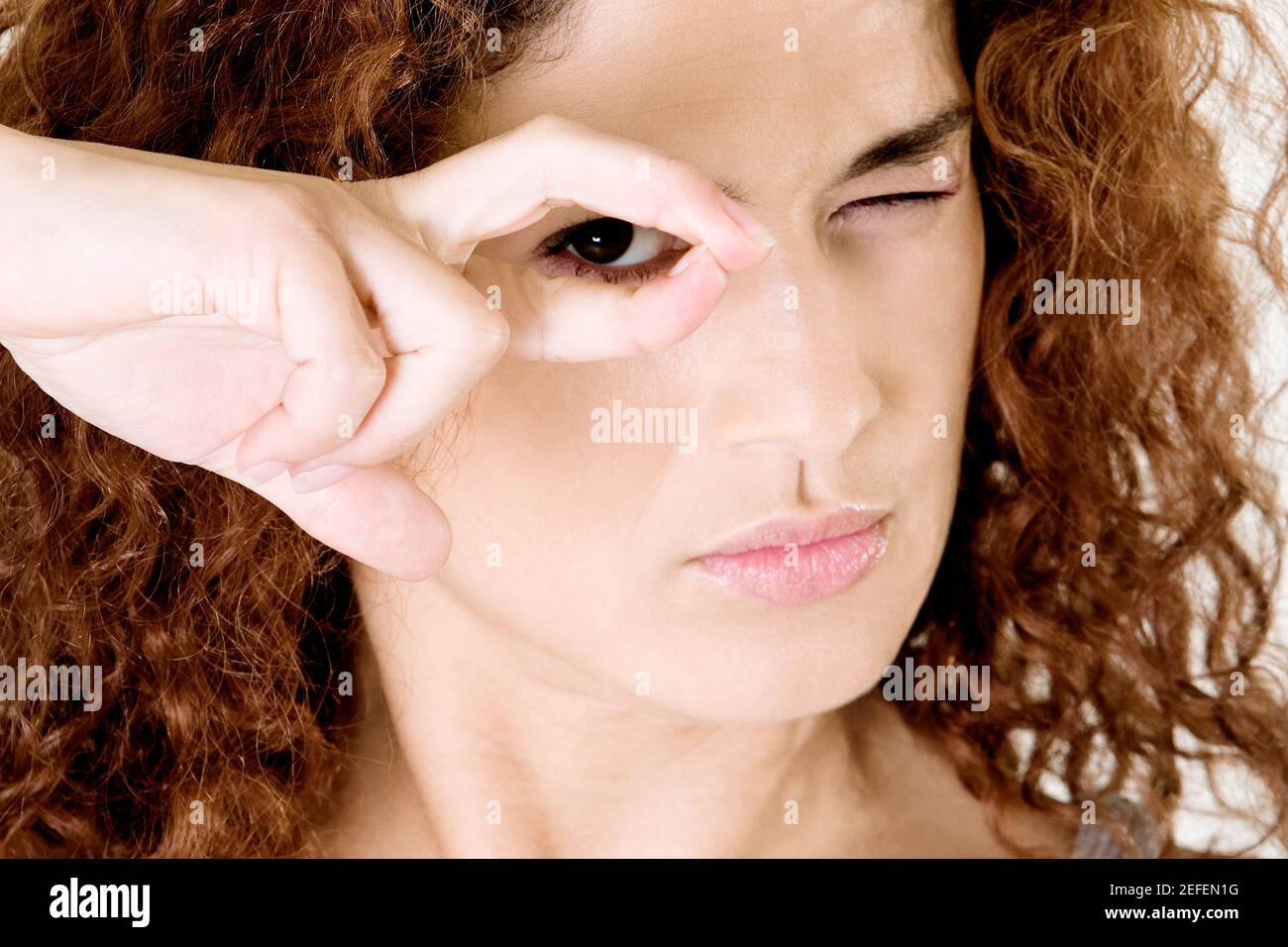 Portrait of a young woman gesturing with her hand Stock Photo - Alamy