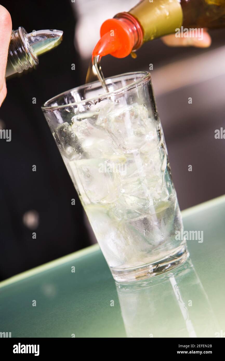 Man pouring alcohol hi-res stock photography and images - Alamy
