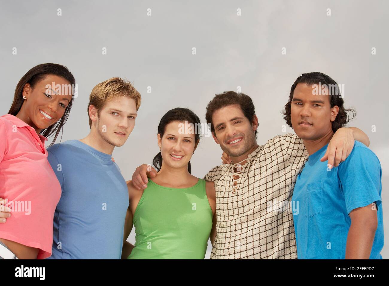 Portrait of five friends standing and smiling Stock Photo - Alamy