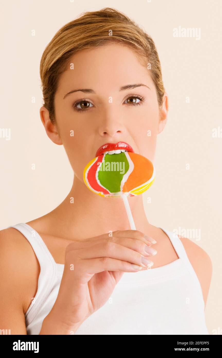 Beautiful woman holding lollipop hi-res stock photography and images ...