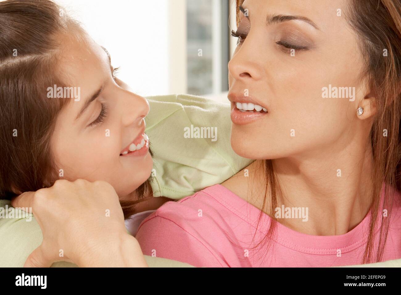 Close-up of a daughter hugging her mother Stock Photo - Alamy