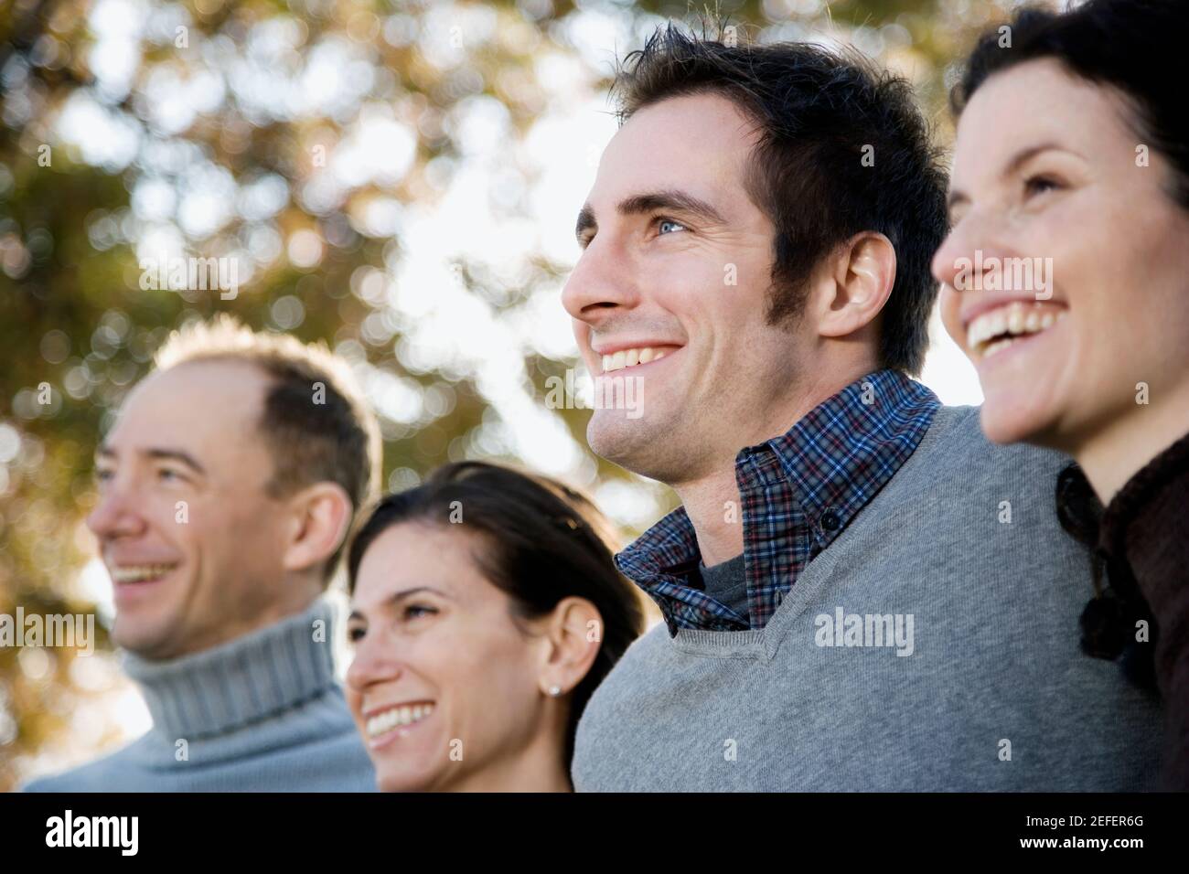 Two couples smiling Stock Photo - Alamy