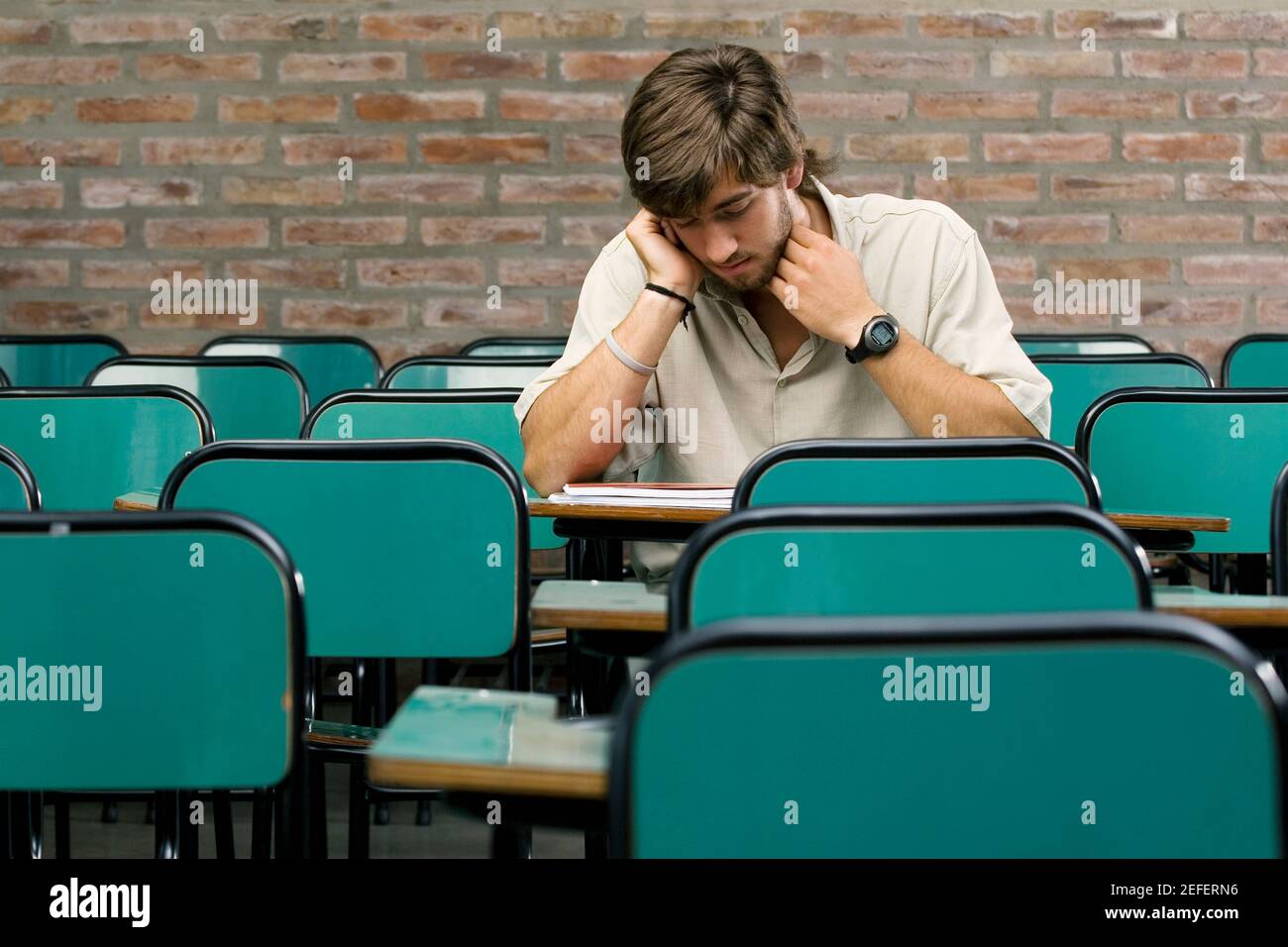 Teenager sitting down in chair hi-res stock photography and images - Alamy
