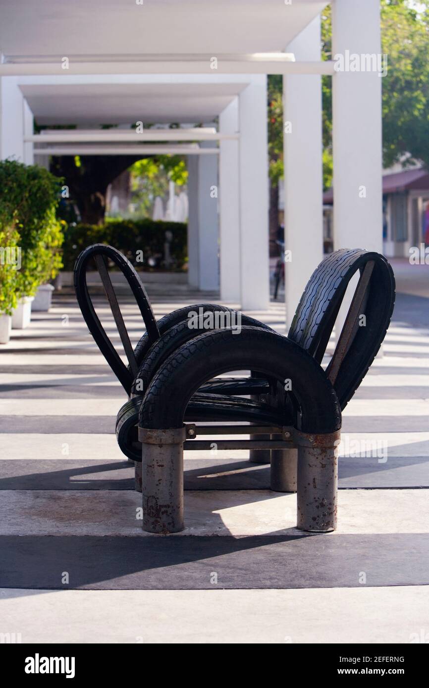 Tires fixed on poles Stock Photo - Alamy