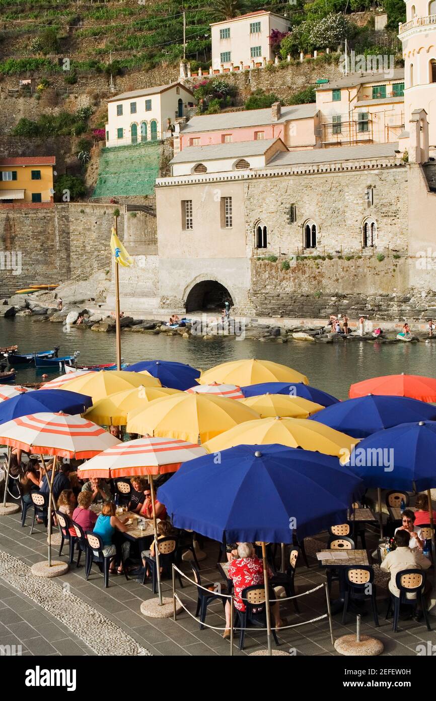 Group of people at a sidewalk cafe, Italian Riviera, Cinque Terre ...