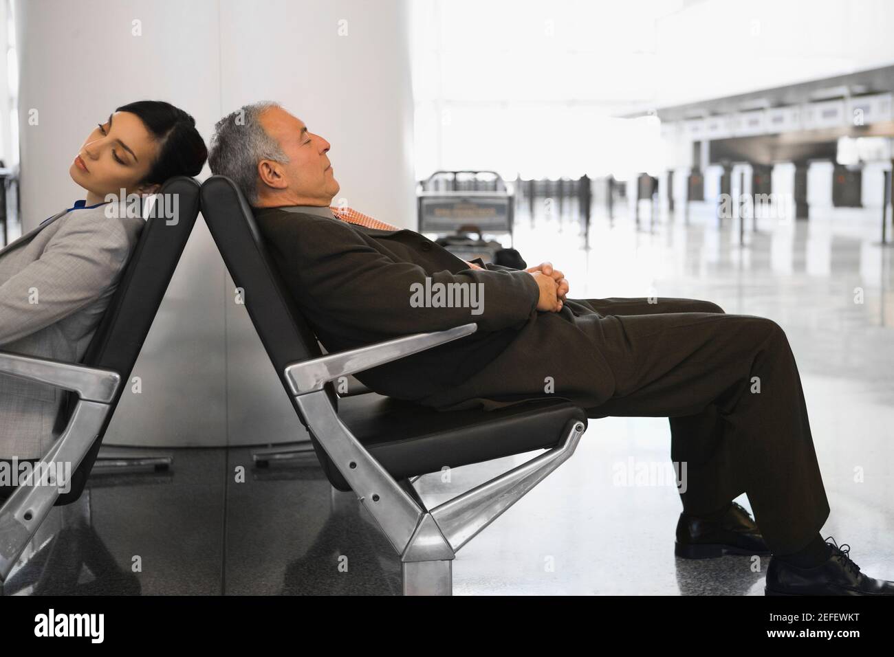 Businessman sleeping airport hi-res stock photography and images - Alamy
