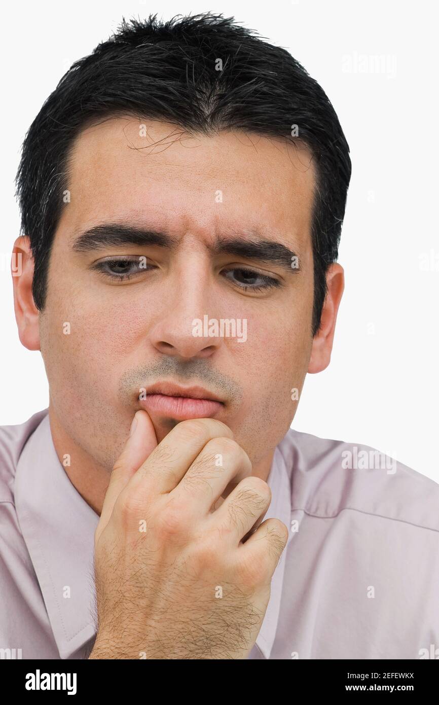 Close up of a businessman with his hand on his chin hi-res stock ...