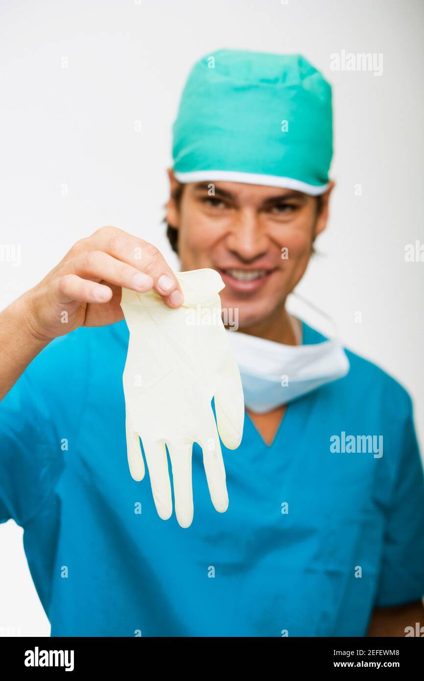Surgeon showing a surgical glove Stock Photo - Alamy