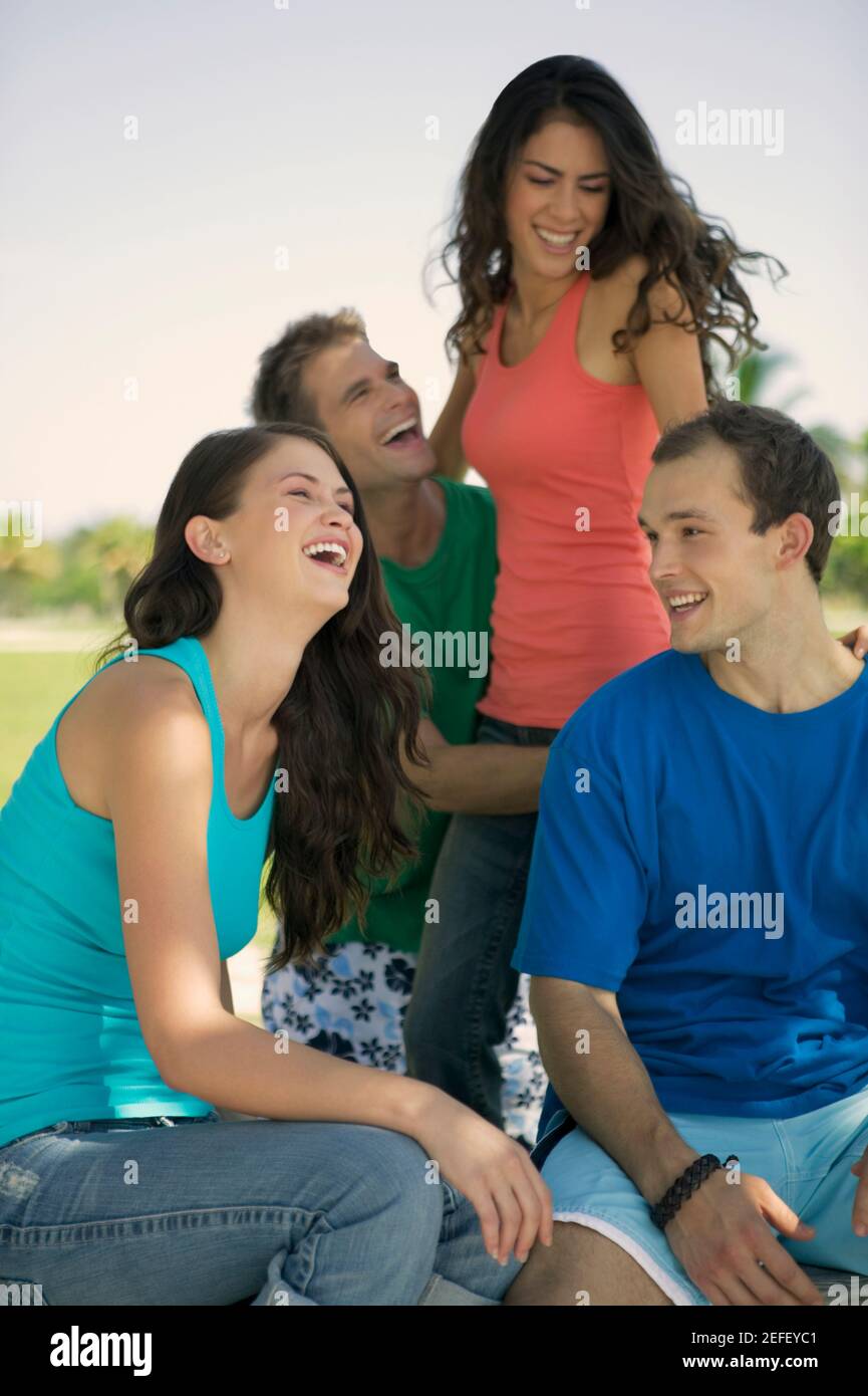 Two young couples smiling Stock Photo - Alamy
