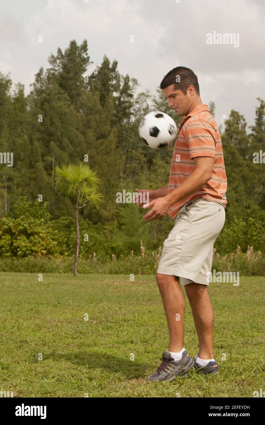Man playing soccer 35 years hi-res stock photography and images - Alamy