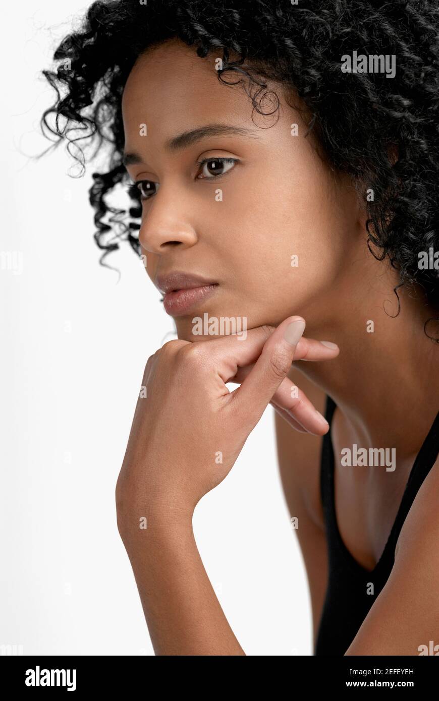 Side profile of a young woman thinking Stock Photo - Alamy