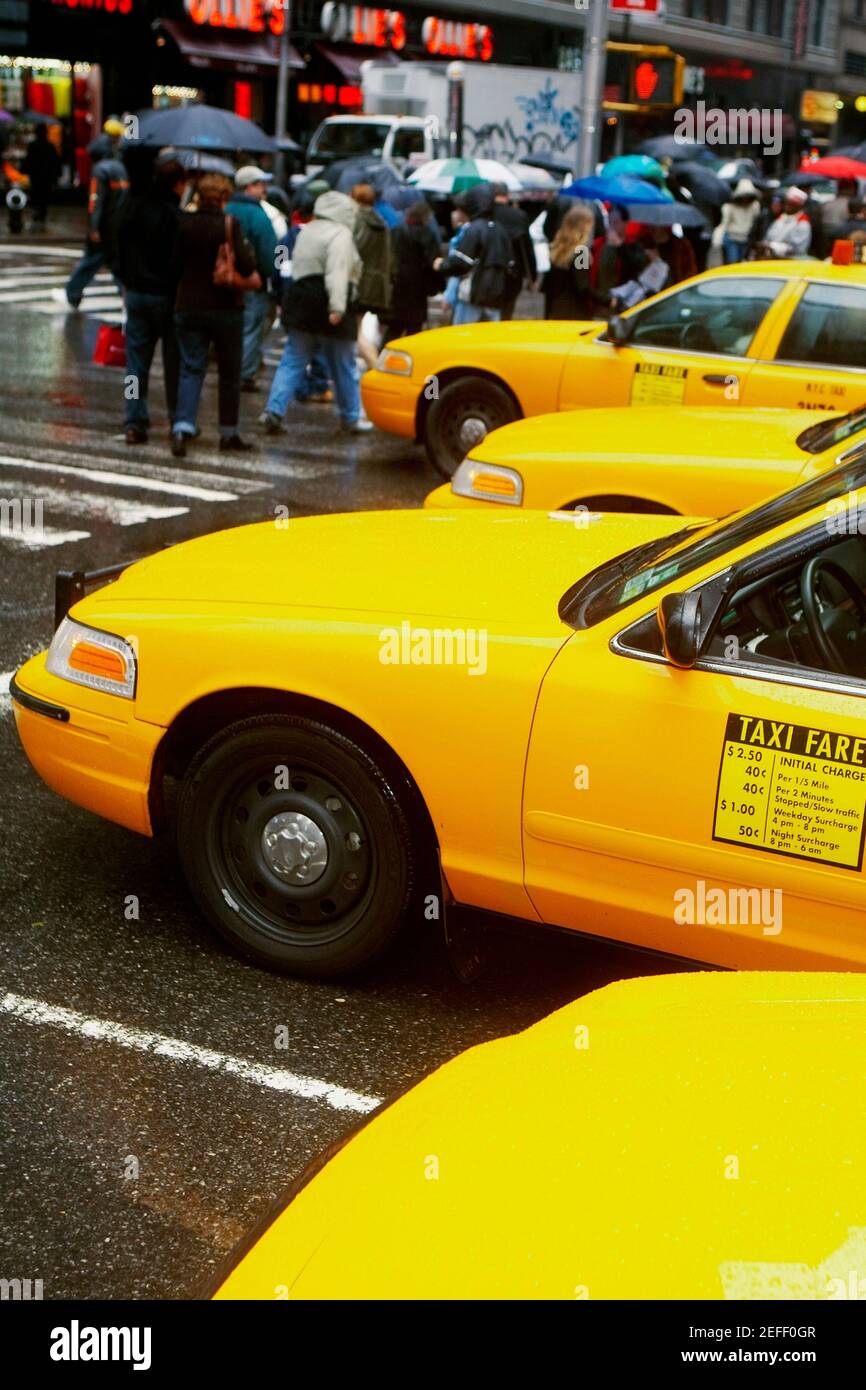 Yellow taxi waiting at the zebra crossing Stock Photo - Alamy