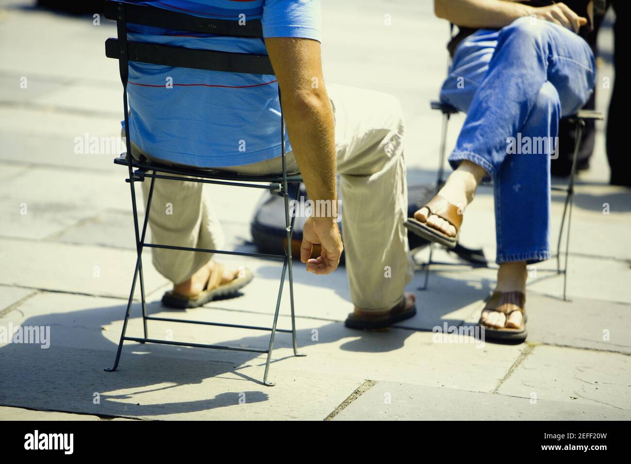 Two people sitting on chairs hi-res stock photography and images - Alamy