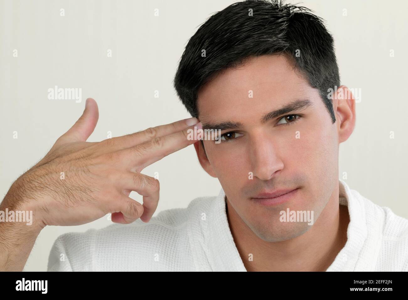 Man making finger gun gesture hi-res stock photography and images - Alamy