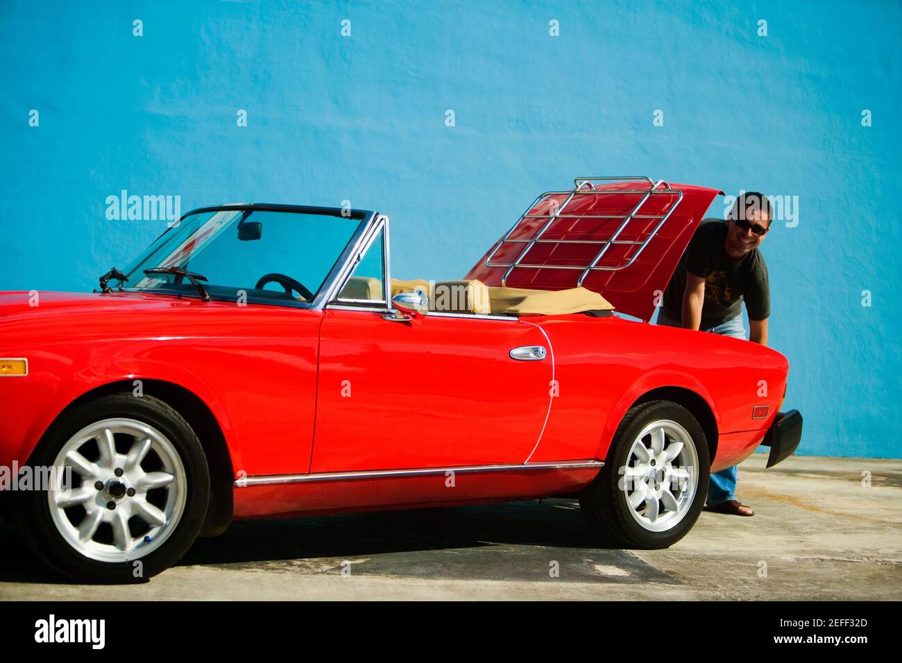Man standing behind car hi-res stock photography and images - Alamy