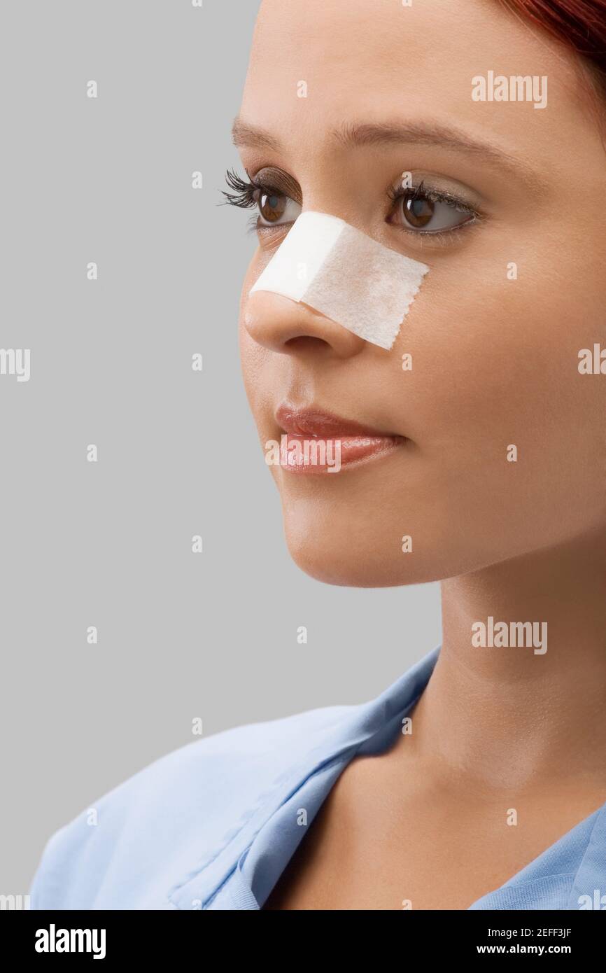 Close up of a female patient with an adhesive bandage on her nose Stock ...