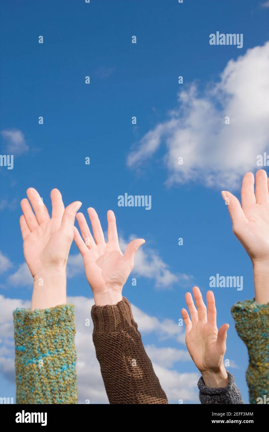 Close up of human hands reaching upwards Stock Photo - Alamy