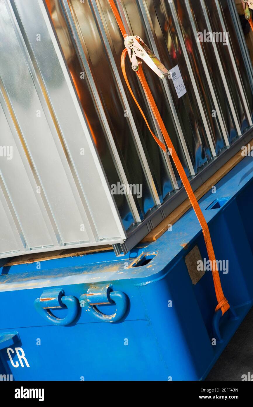 Close-up of a cargo container tying up with a belt Stock Photo - Alamy