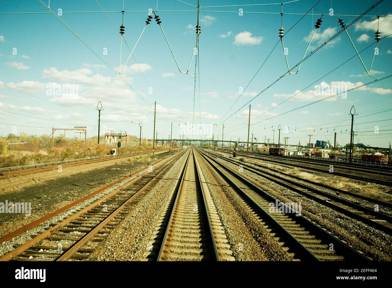 Power cables over railroad tracks Stock Photo - Alamy