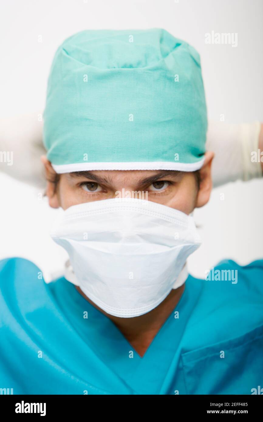 Portrait of a surgeon wearing a surgical mask on his face Stock Photo ...