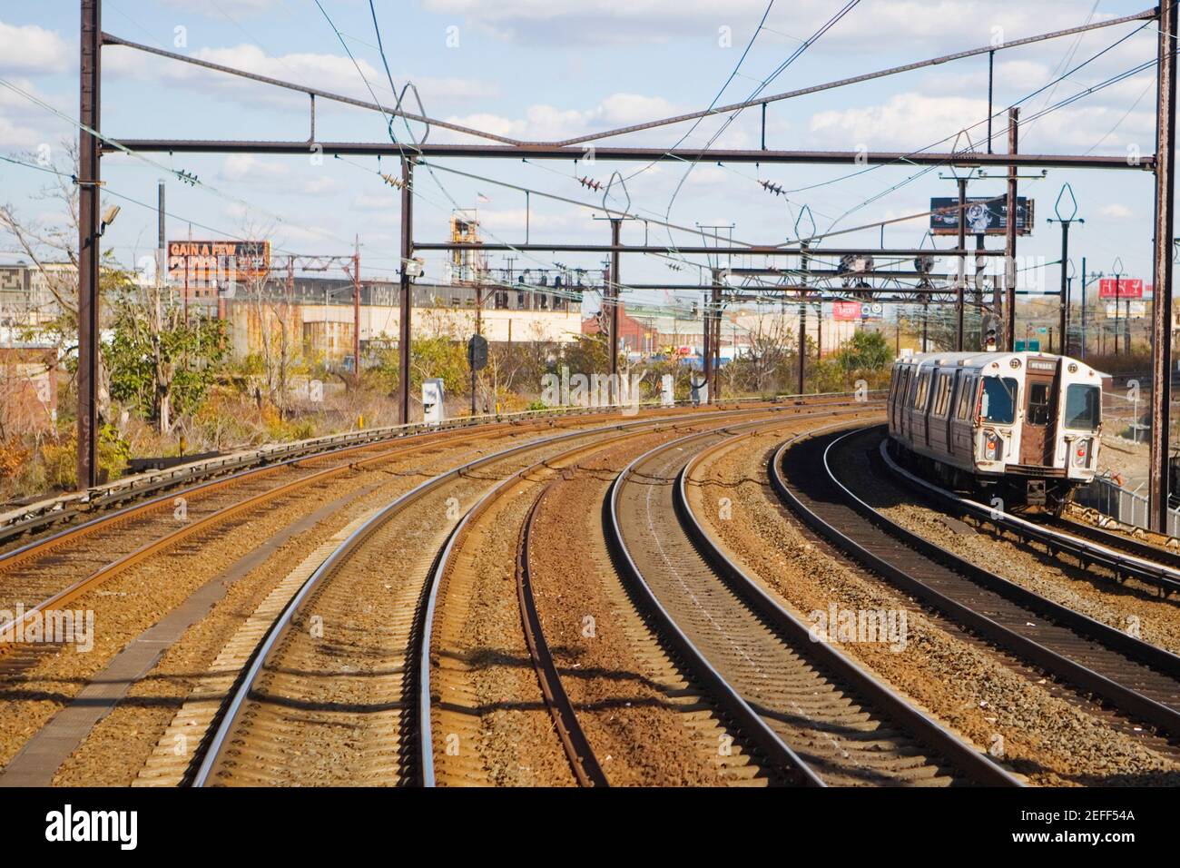 Train on railroad track Stock Photo - Alamy